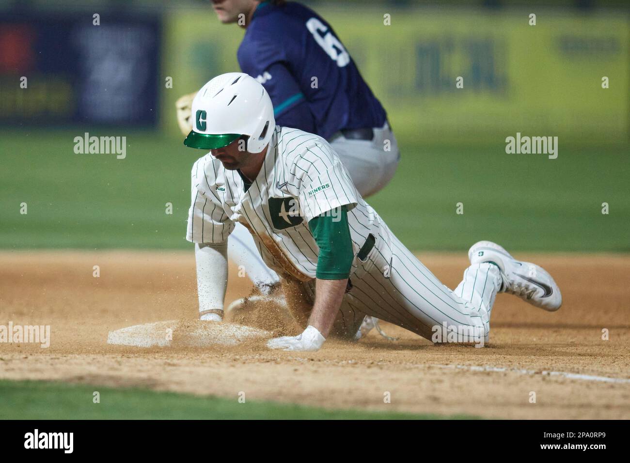 Josh Patrick (17) of the Charlotte 49ers slides head first into third ...