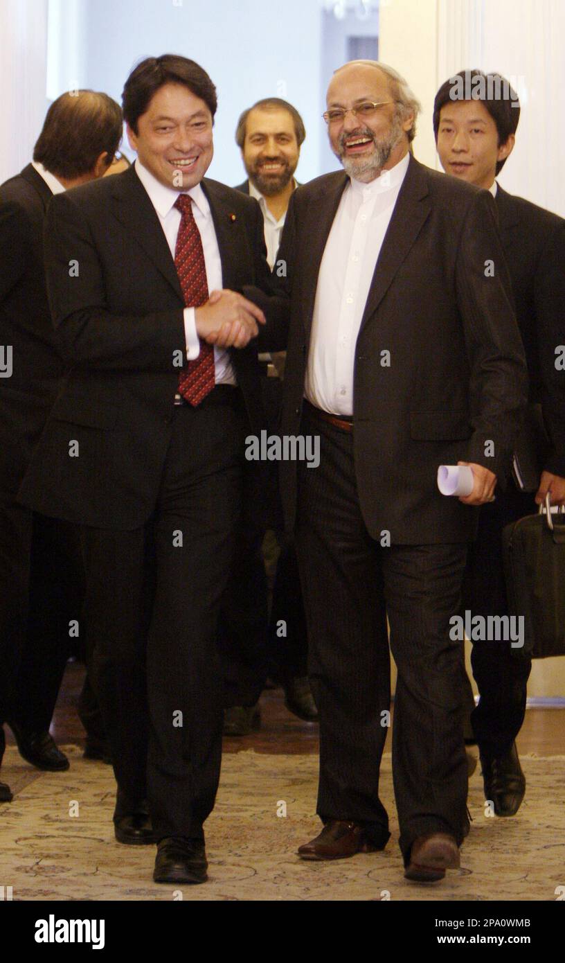 Iranian Deputy Foreign Minister Alireza Sheikh-Attar, right, shakes ...