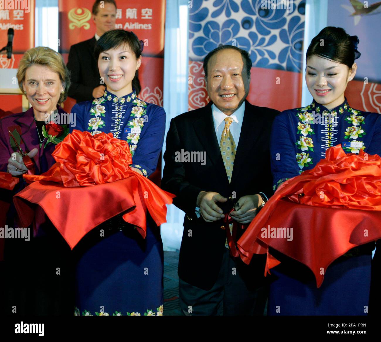 Chen Feng, second from right, chairman of HNA Group, the parent company ...