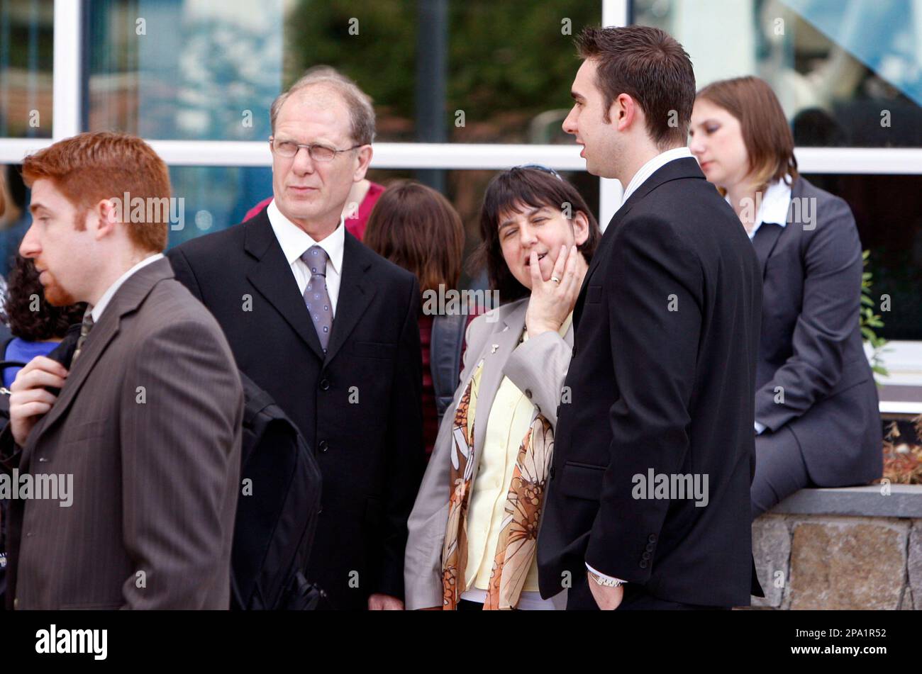 Cliff Entwistle, second left, his wife Yvonne, center, and their son ...