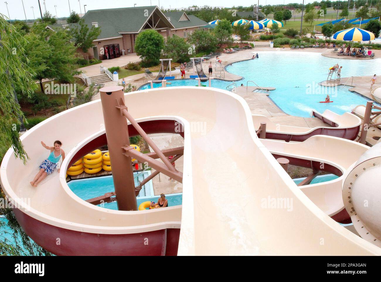 Ashley Conner twists her way through a water slide on Memorial Day at ...