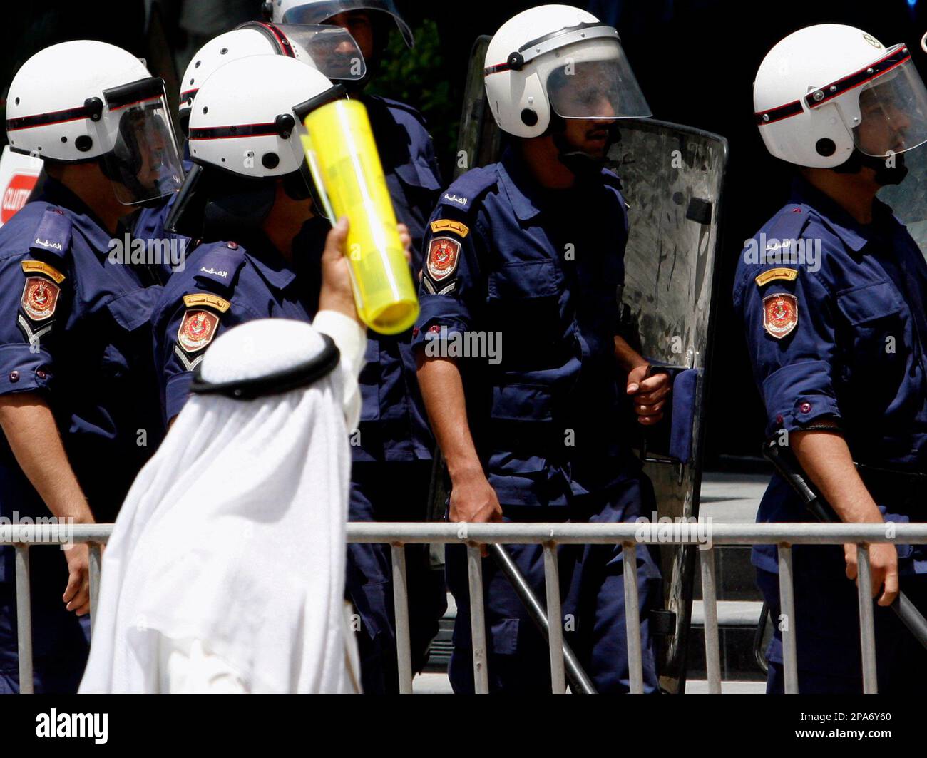 Unidentified Bahraini man shouts at riot police for keeping him back ...