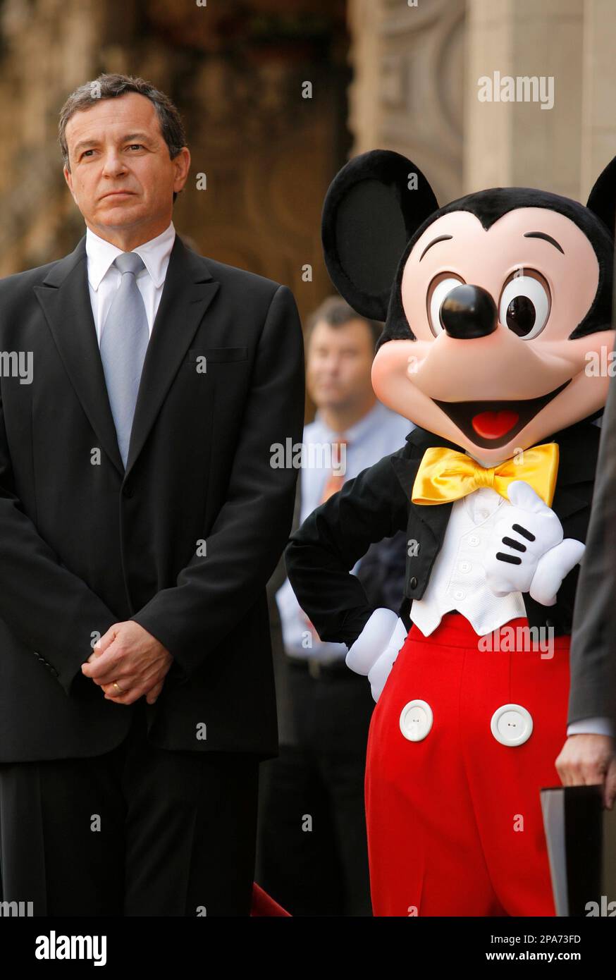 Bob Iger, President, CEO, The Walt Disney Co. left, and Mickey Mouse ...