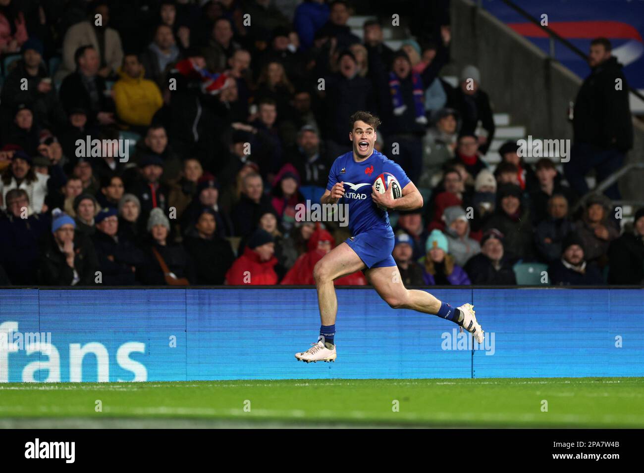 France's Damian Penaud on his way to score a try during the Six Nations ...