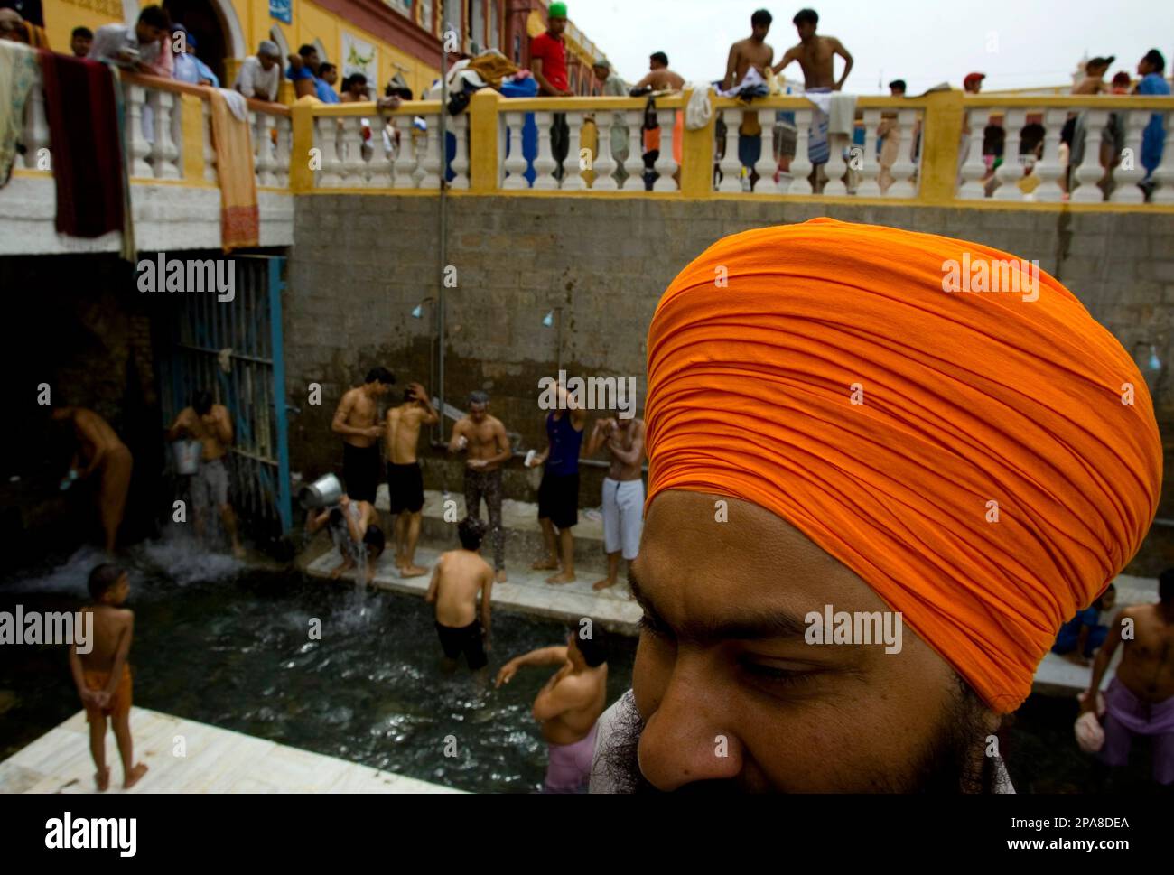 Sikh devotees take a holy bath at Punja Sahib, where thousands of Sikh ...