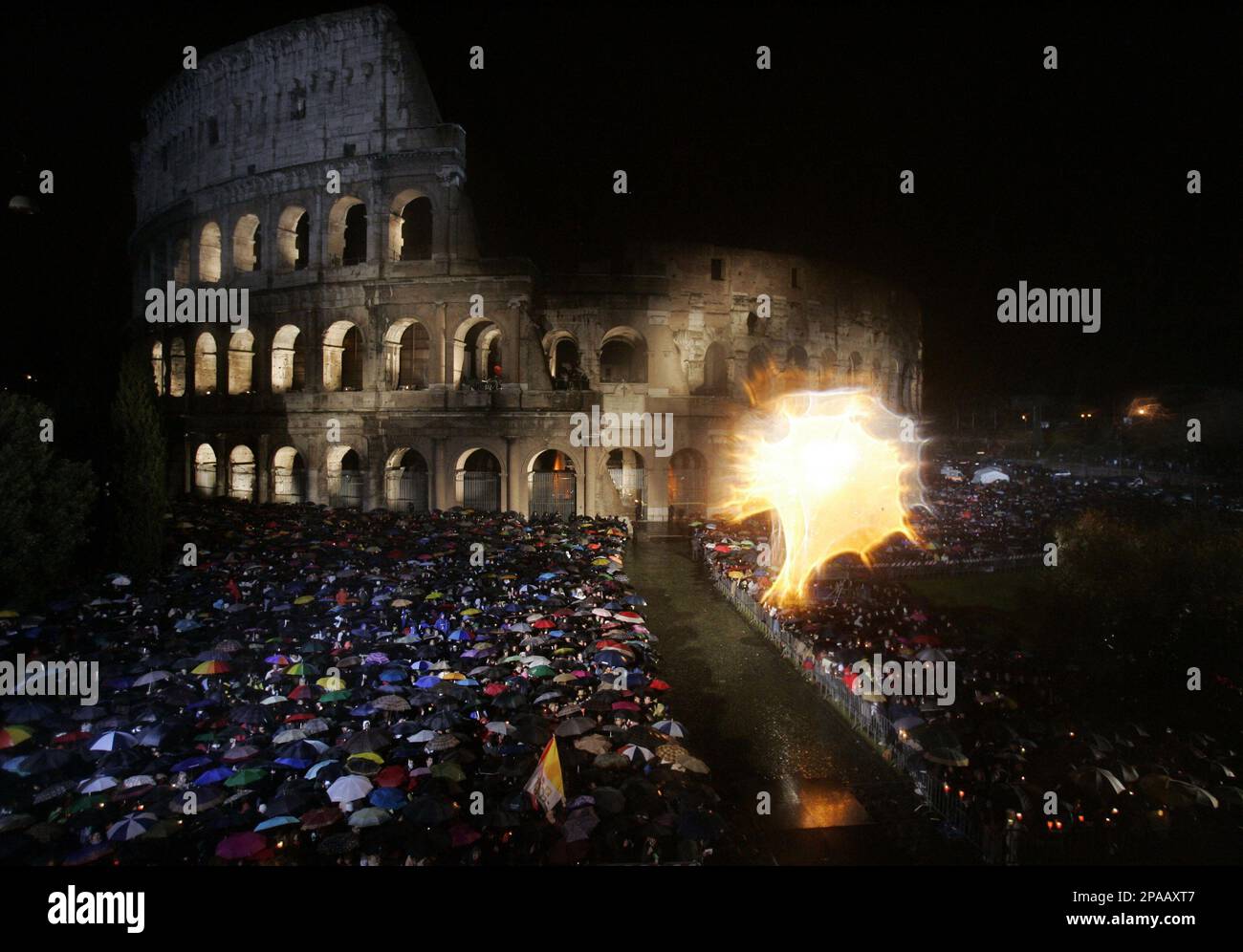 Faithful gather in front of the Colosseum during the Via Crucis (Way of ...