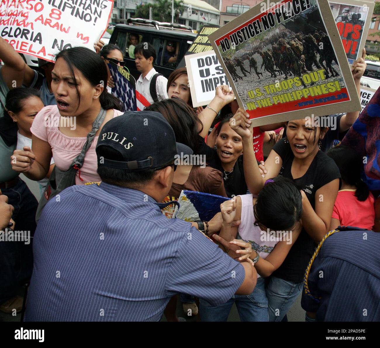 Riot police push back protesters as the latter attempt to hold a brief ...