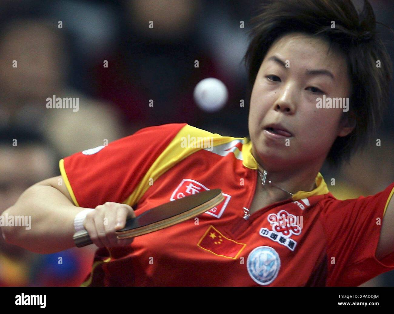 China's Zhang Yining in action against Singapore's Feng Tian Wei ...