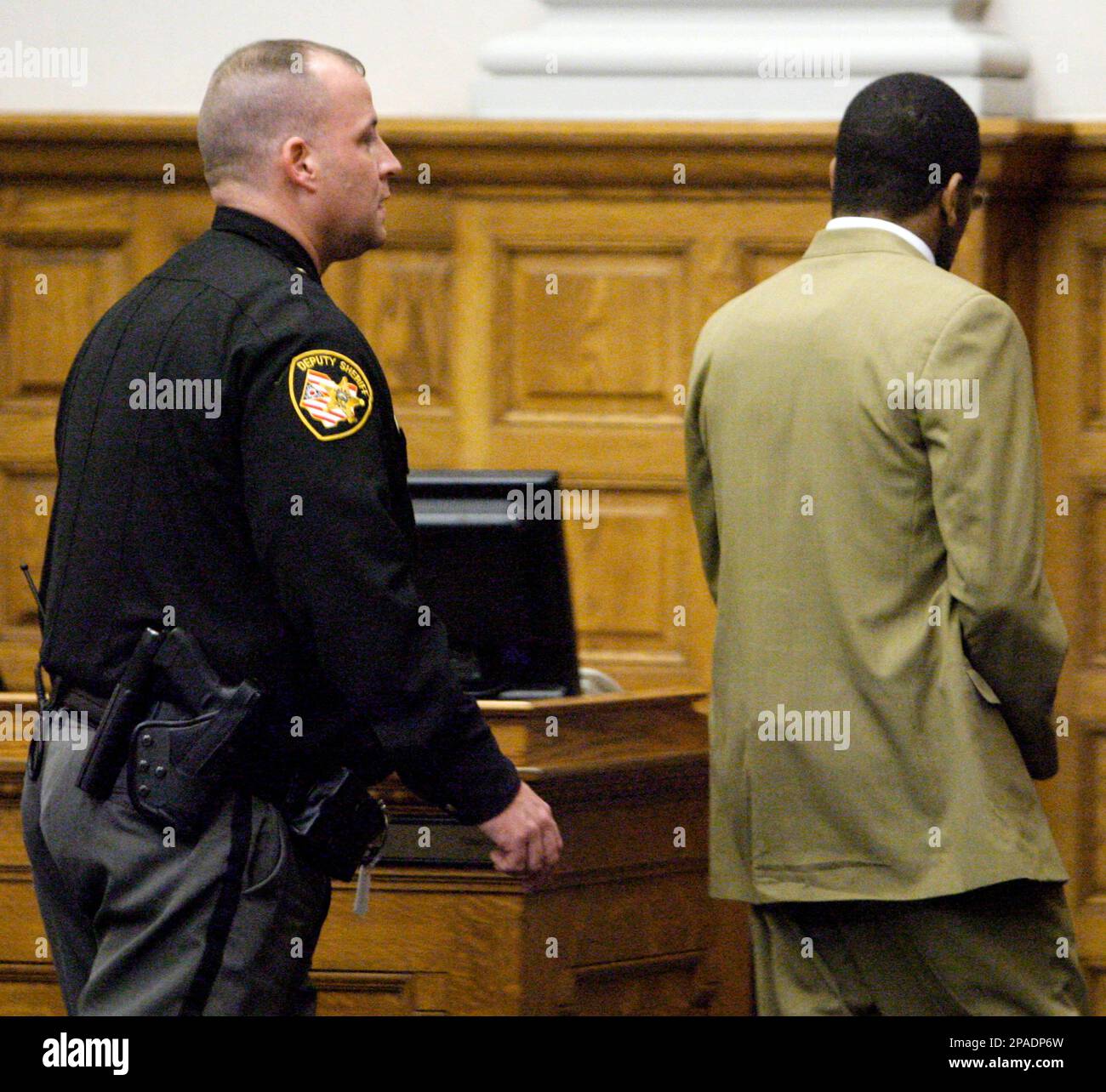 Bobby Cutts Jr., right, leaves the courtroom escorted by a deputy ...