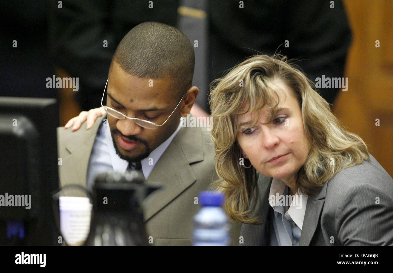 Former Canton police officer Bobby Cutts Jr., left, sits with attorney ...