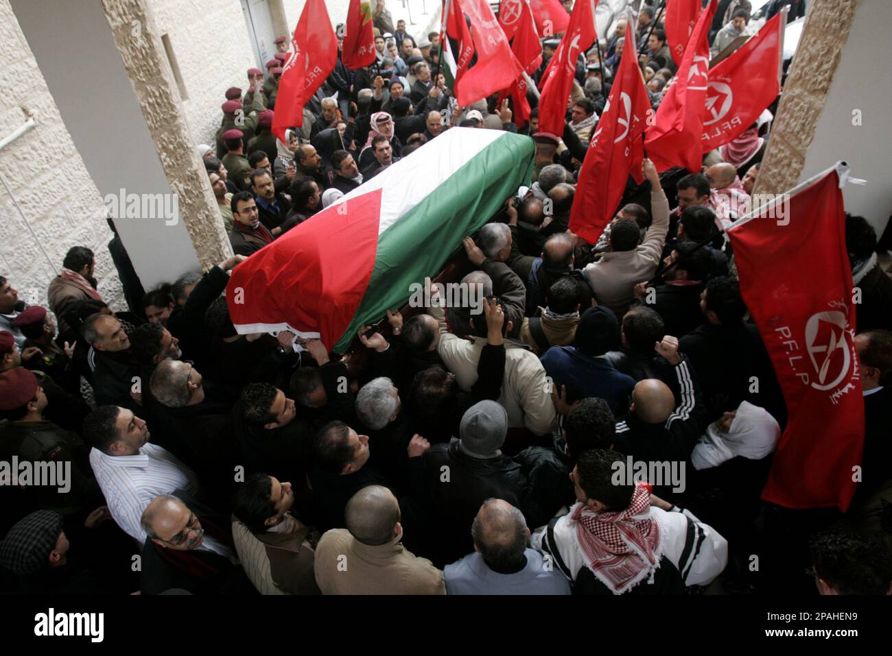 Mourners carry the coffin of George Habash, founder of the Popular ...