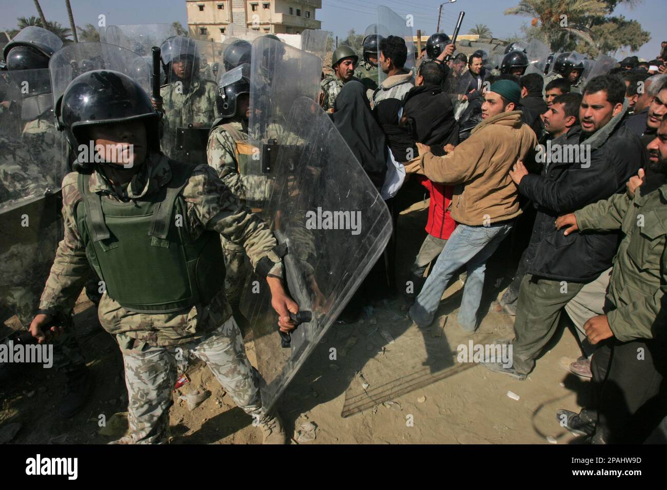 Egyptian border guards and riot police officers clash with Palestinians trying to cross the ...