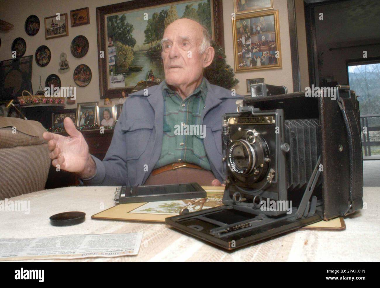 ** FILE ** Former U.S. Army photographer Lee Embree, shown with his ...
