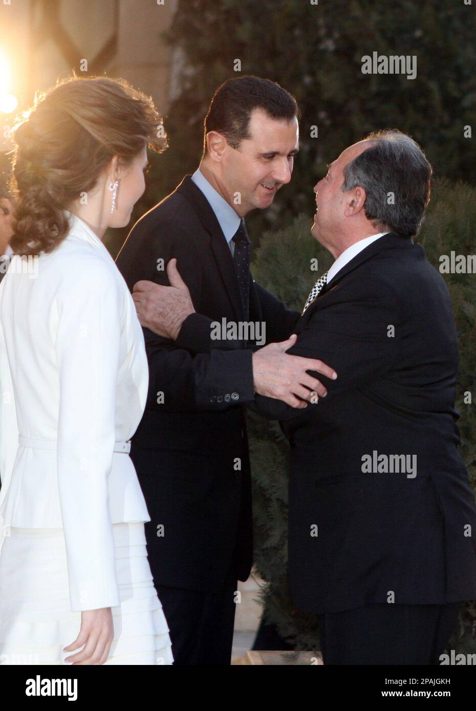 Syrian President Bashar Assad and his wife Assma Assad welcoming ...
