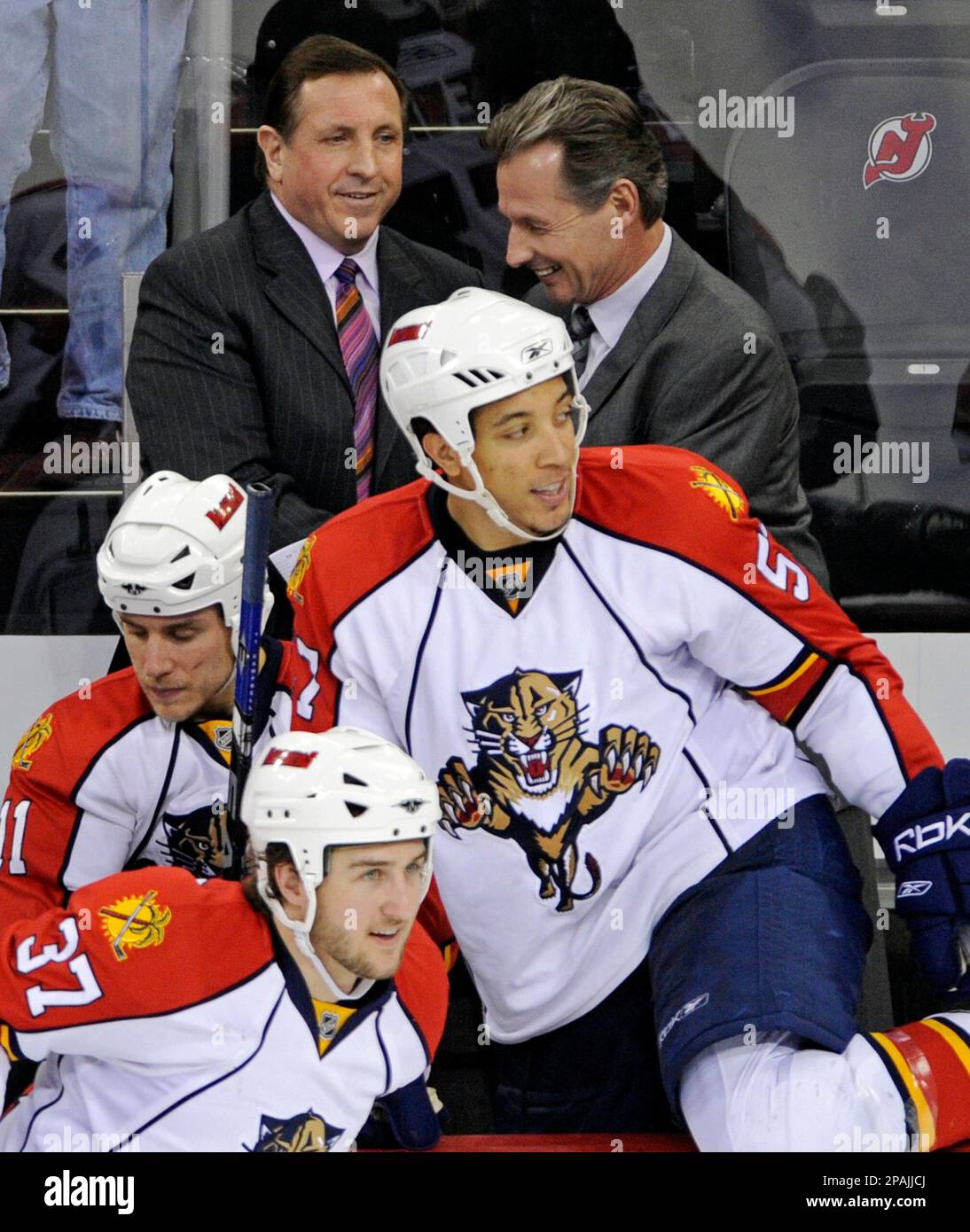 Florida Panthers coach Jacques Martin, top left, shakes hands with ...