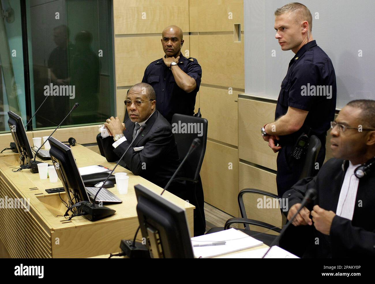 Former Liberian President Charles Taylor, left, with others ...