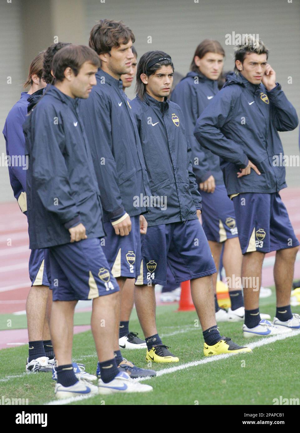 Boca Juniors players listen to their coach during their official ...