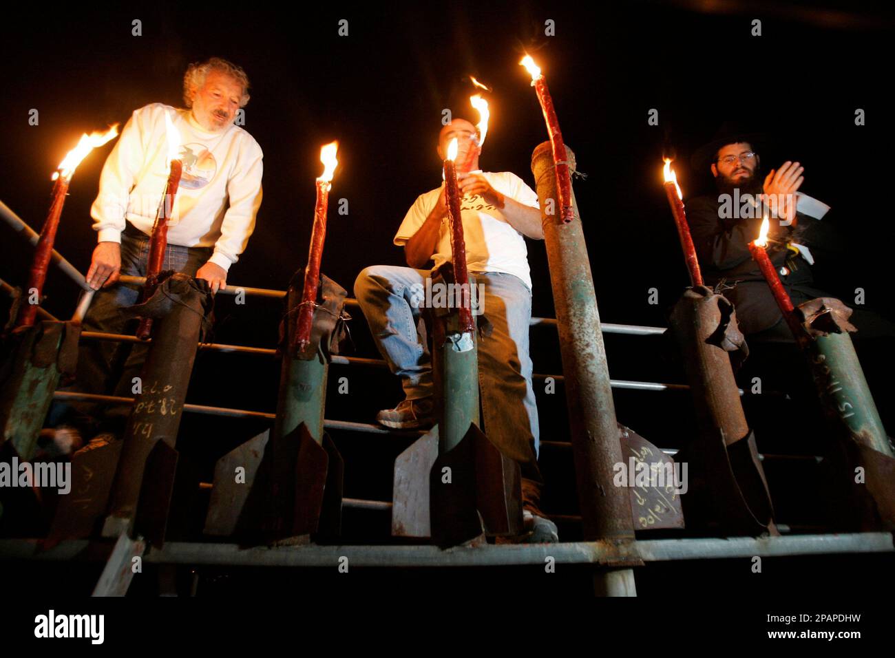 Israelis light candles of a Hanukkiah,a Jewish candle holder ...