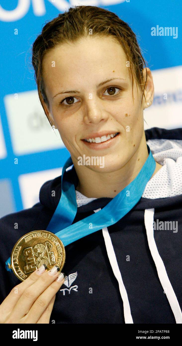 France's swimmer Laure Manaudou poses with her gold medal during the ...
