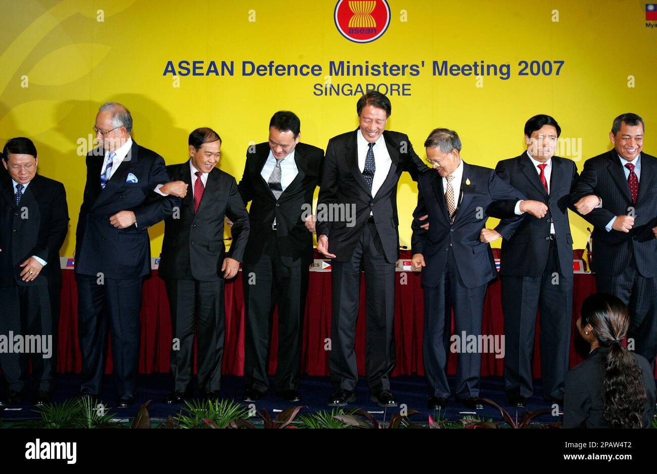Defense Ministers lock arms and pose from left to right, Lieutenant-Gen ...