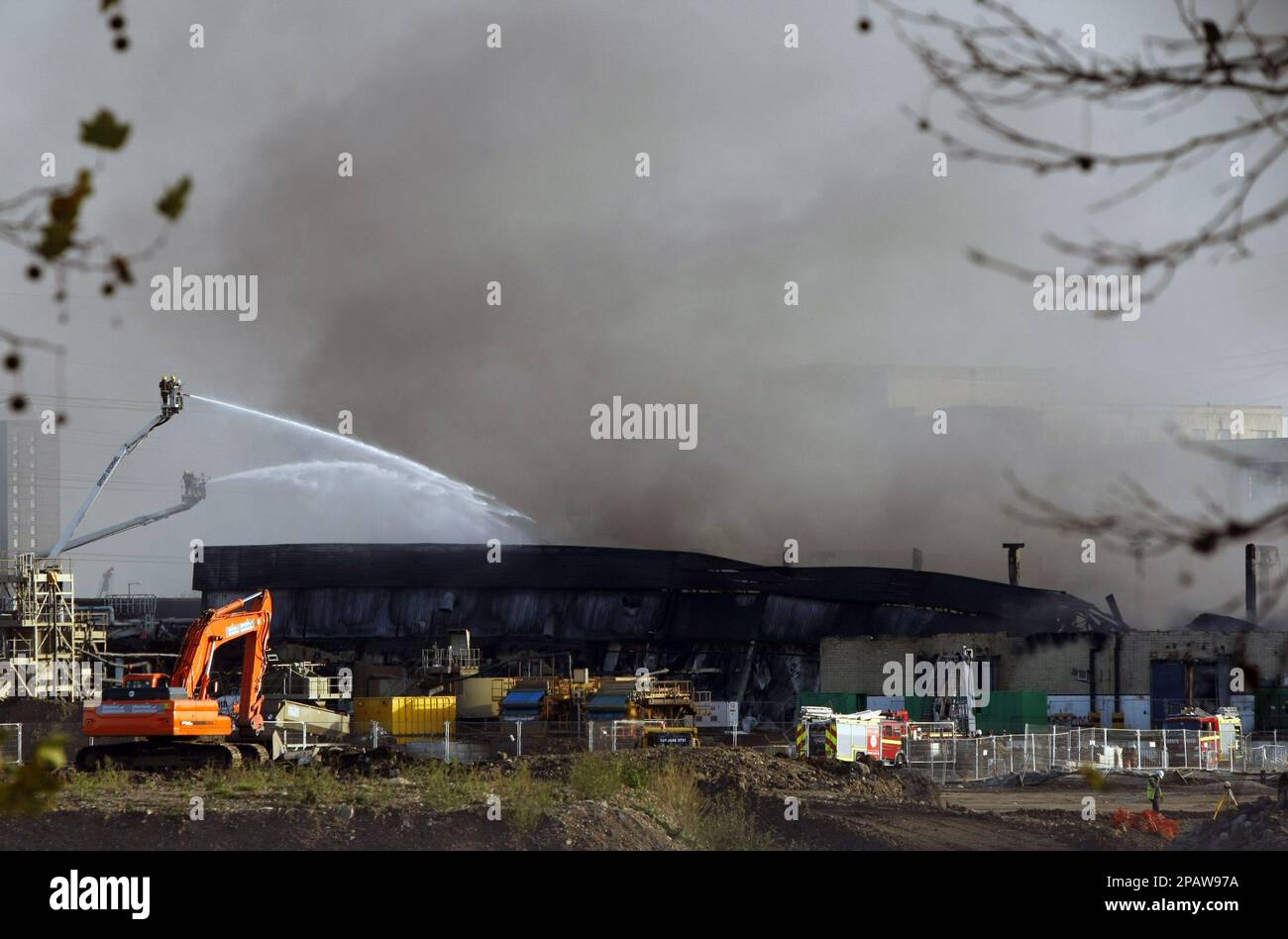 Firefighters tackle a blaze at a warehouse in east London, Monday Nov ...