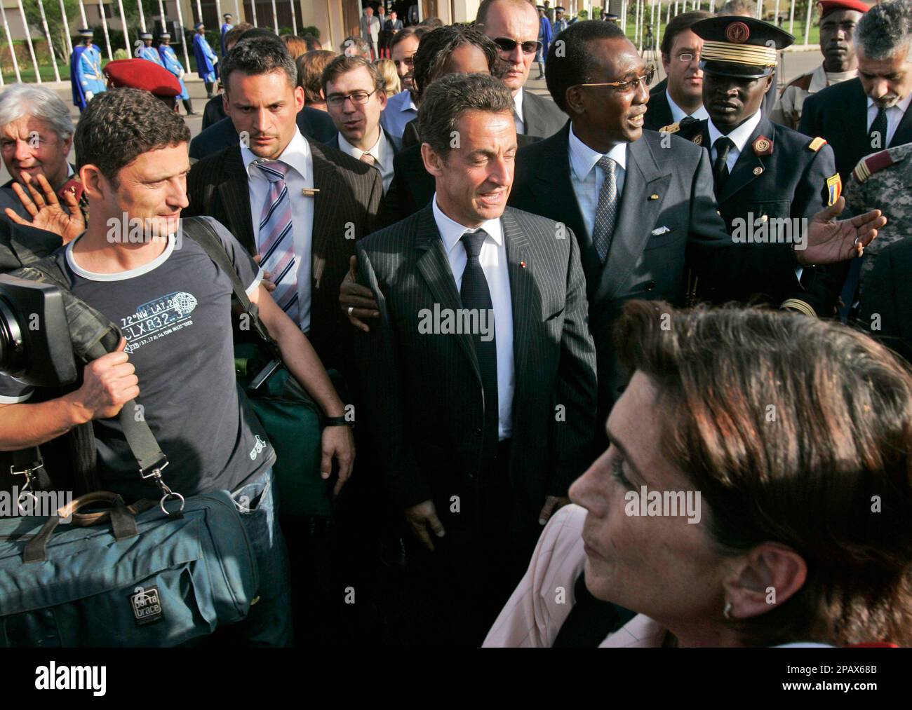 French journalist from Capa agency, Marc Garmirian, left, walks beside ...