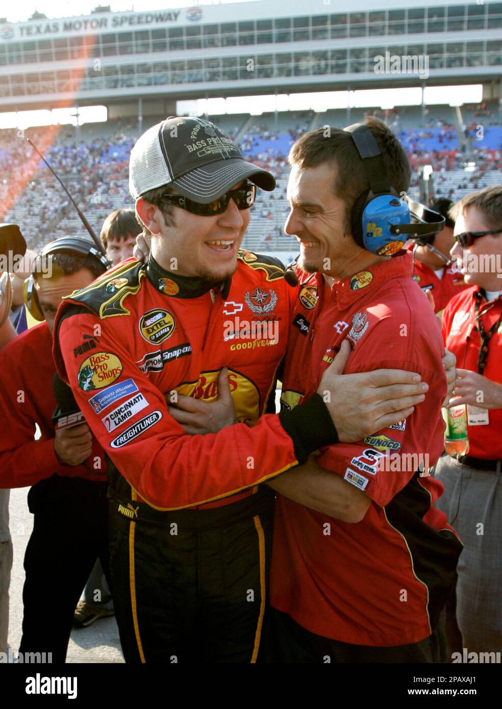 NASCAR Nextel driver Martin Truex Jr. left, celebrates with crew member ...