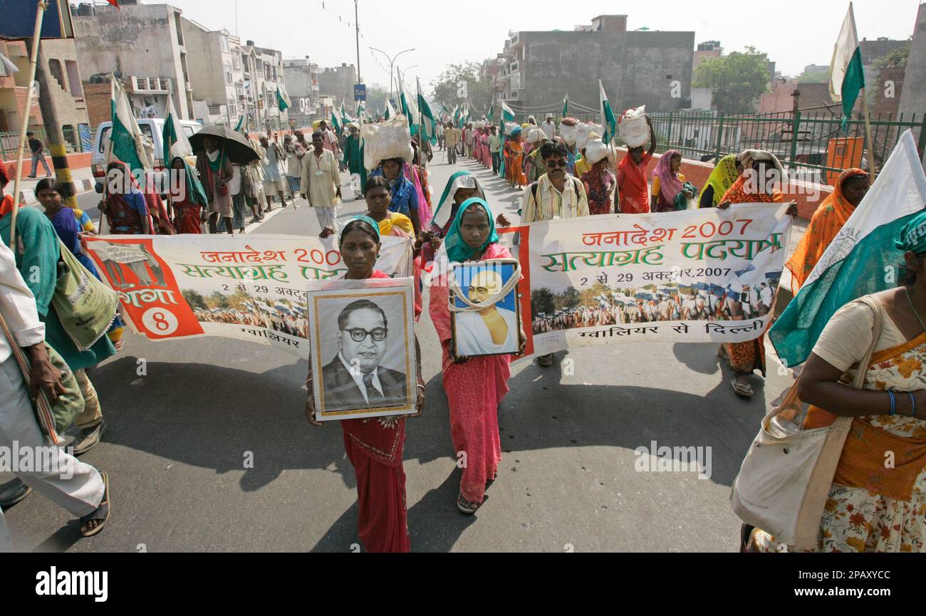 Protestors carry portraits of Indian freedom fighters Mahatma Gandhi ...