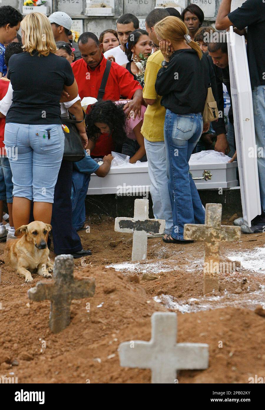 Relatives react during the funeral for 4-year-old Jorge Kaua, in Rio de ...