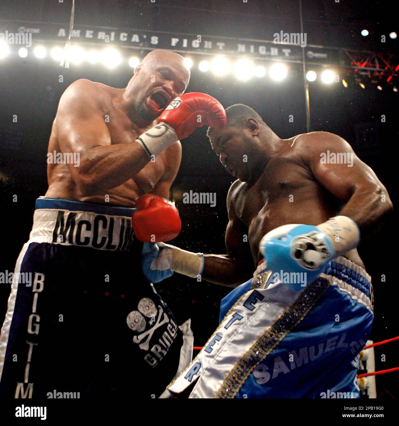 Nigeria's Samuel Peter, right, lands a punch against Jameel McCline ...