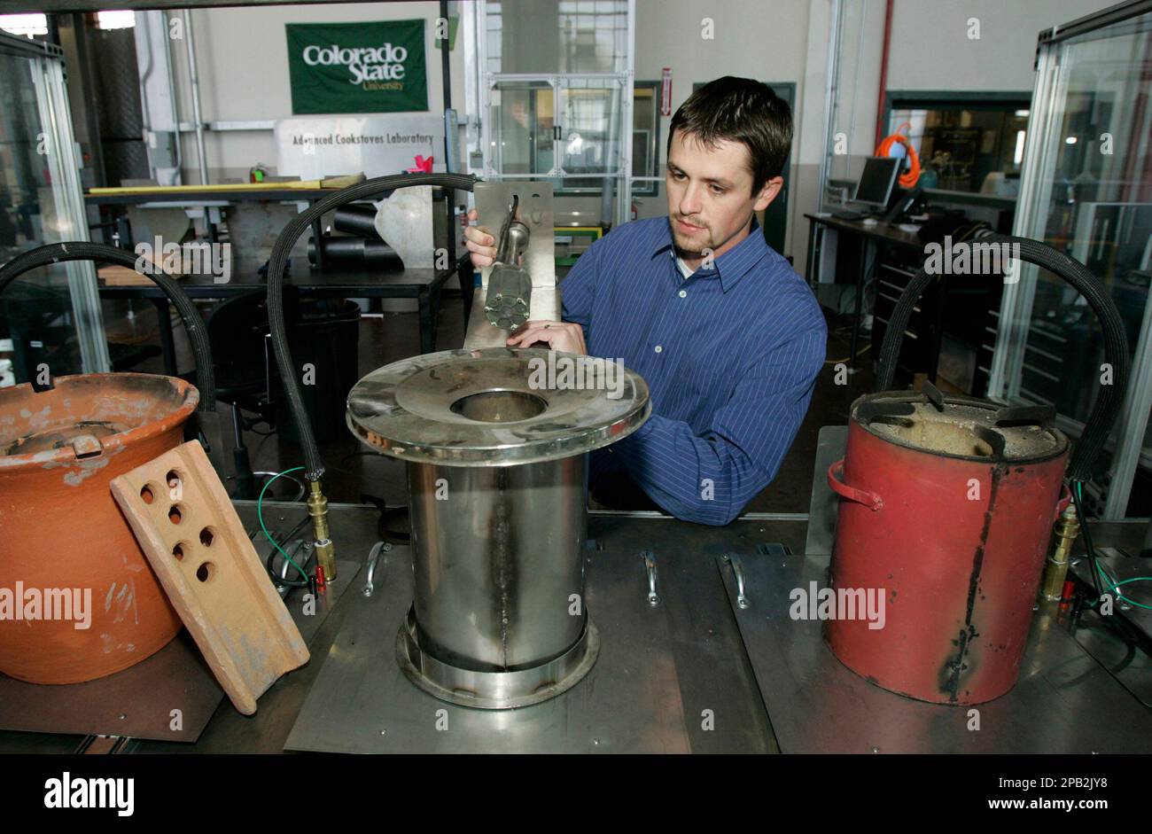 Nathan Lorenz, Envirofit's vice president of engineering, examines a ...