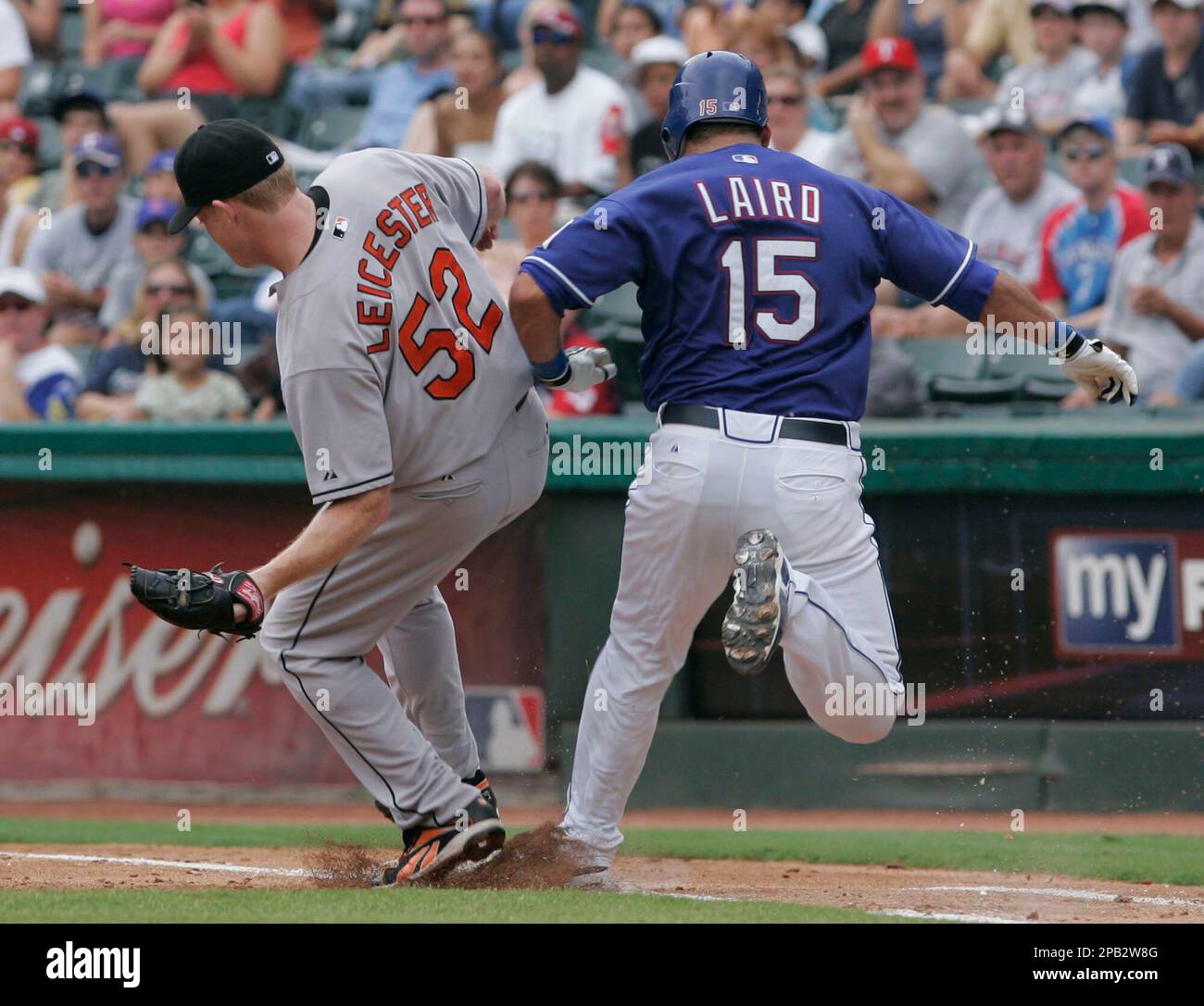 Texas Rangers' Gerald Laird (15) is safe at first base on an infield ...