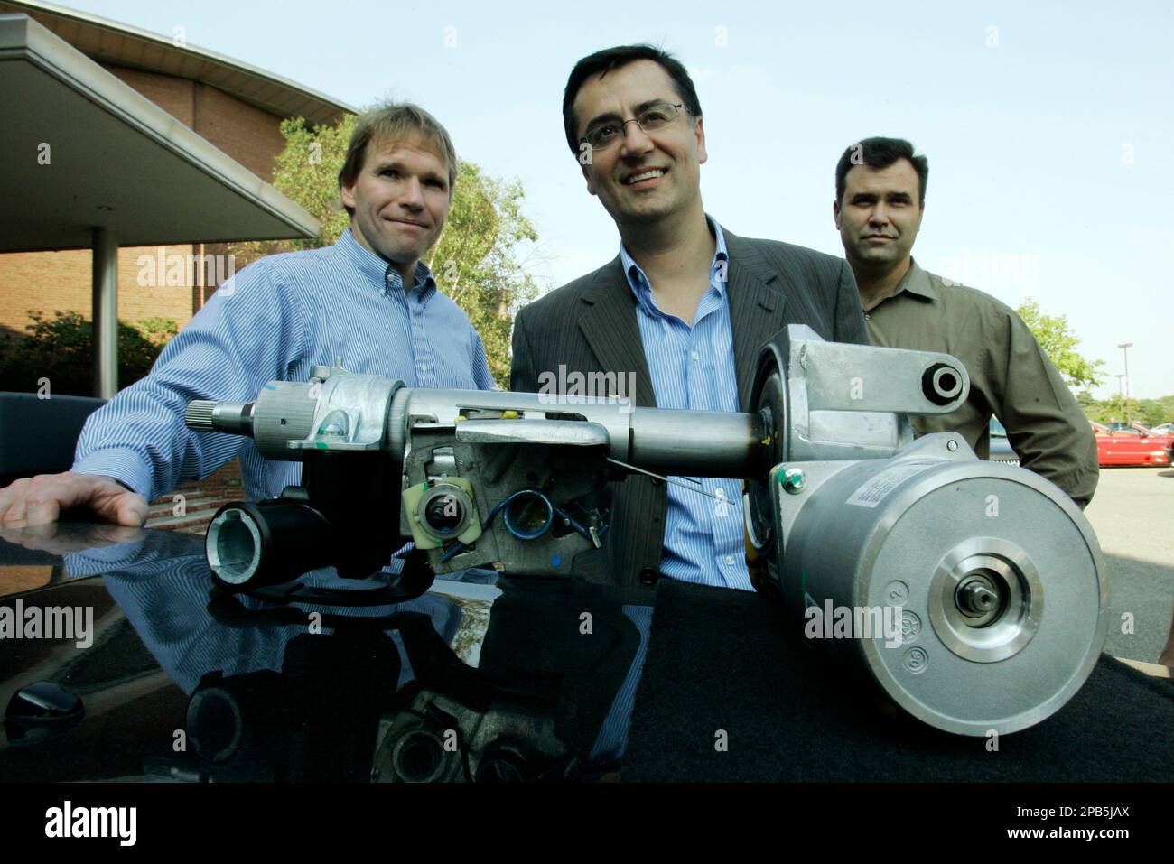 Ali Jammoul, center, Ford's chief engineer for chassis in North America ...