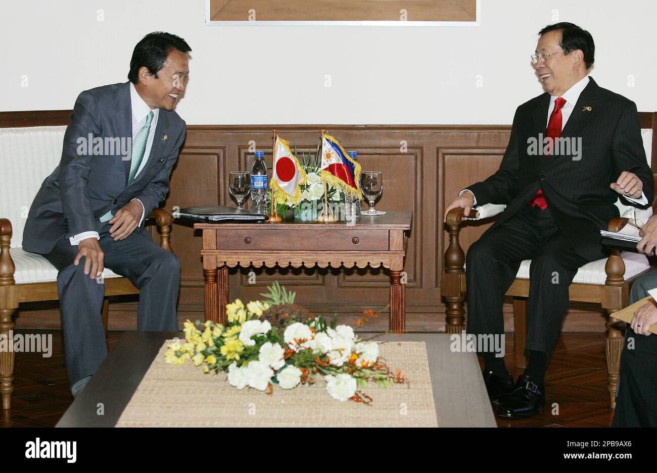 Philippine Foreign Affairs Secretary Alberto Romulo, right, laughs with ...