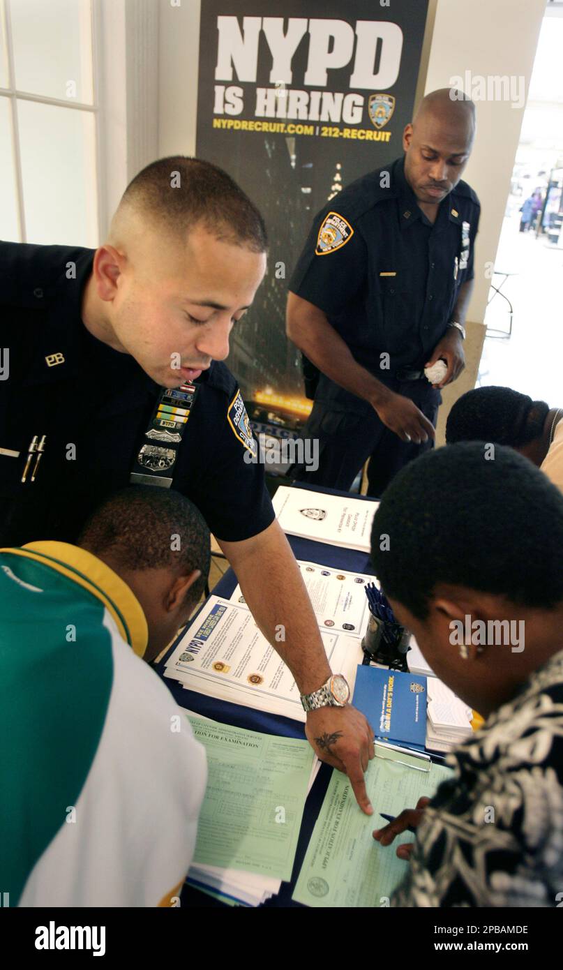 New York City Police Officers Ryan Jackson, top right, and Carlos ...