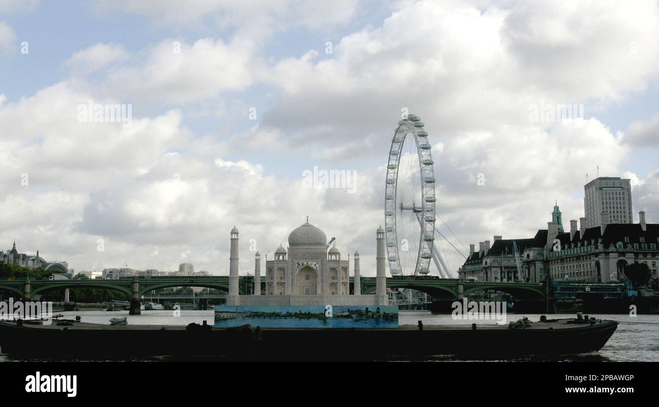 A model of India's Taj Mahal floats down the Thames river past The ...