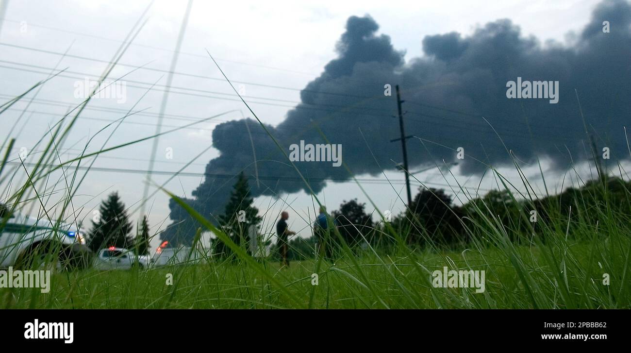 Police officials control the scene after lightning struck a huge ...