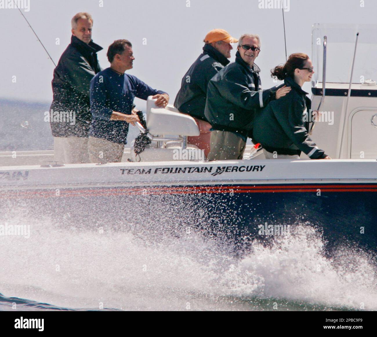 President George W. Bush places his hand on the shoulder of his ...