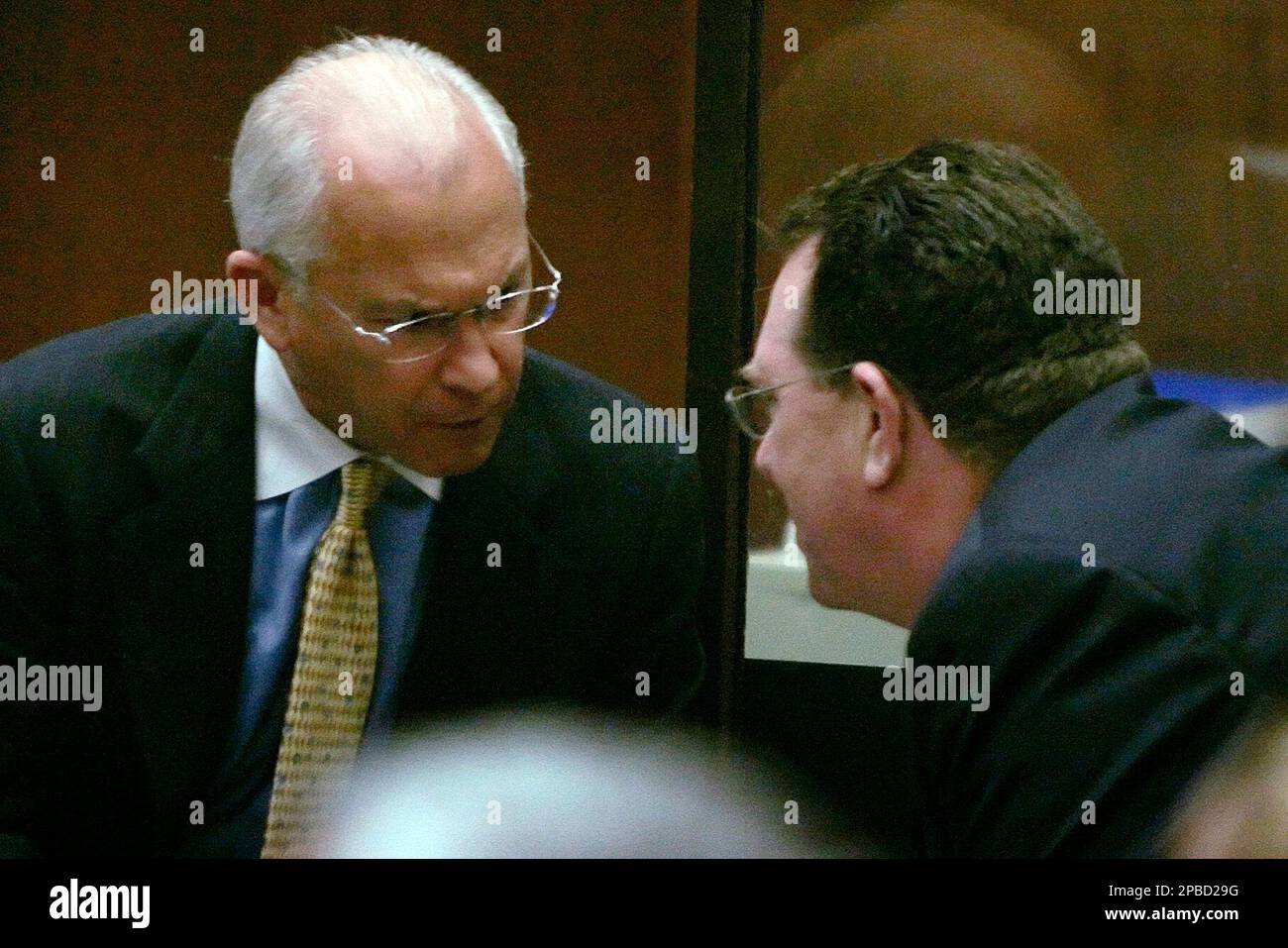 Defense attorneys Roger Rosen, left, and Christopher Plourd confer ...