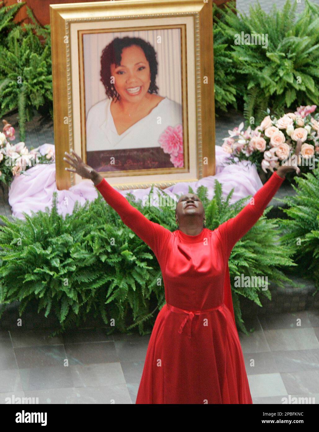 Barbara Sullivan dances in front of a portrait of Yolanda King during a memorial service for ...