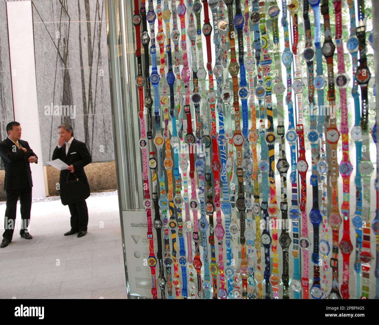 Swatch watches are displayed on the wall of an elevator at Nicolas G ...