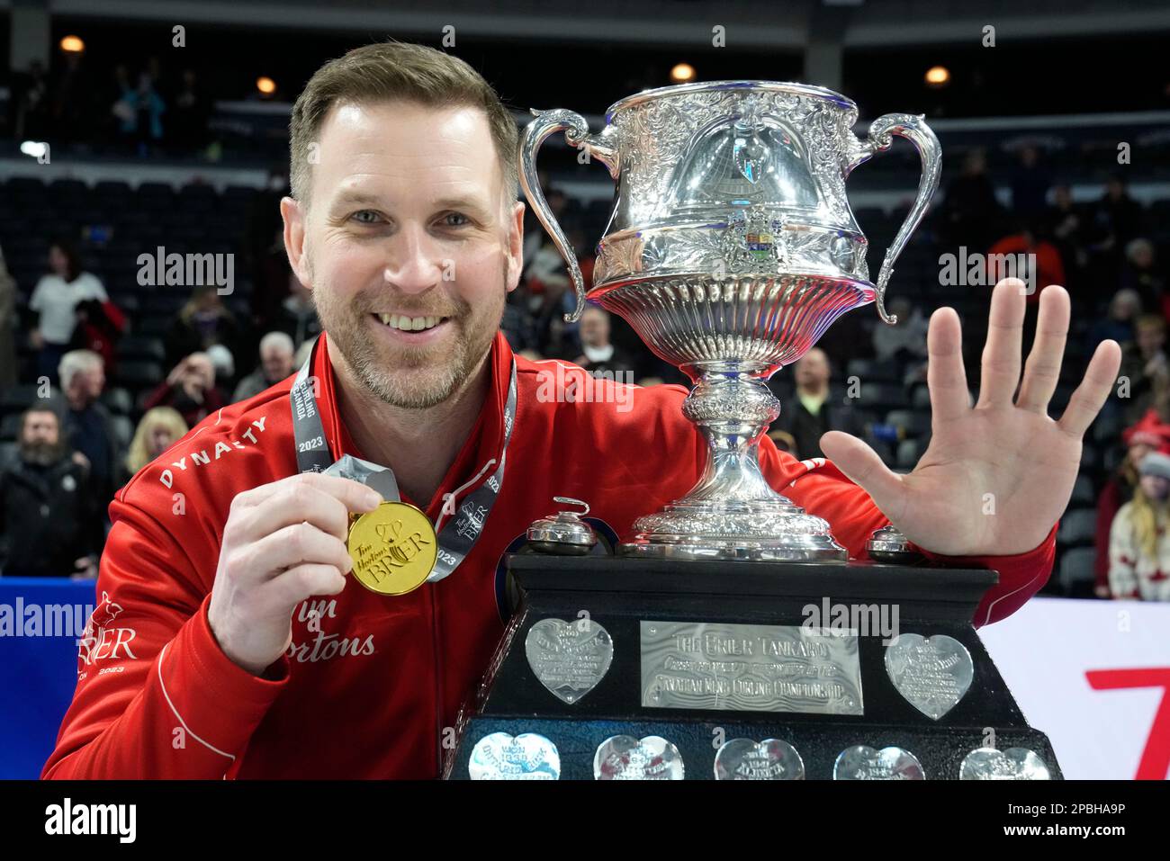 Team Canada skip Brad Gushue celebrates while holding five fingers open ...
