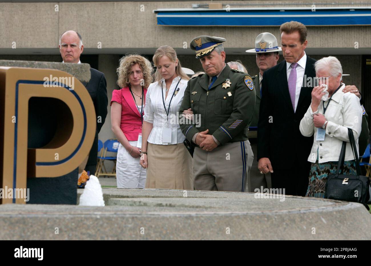 Cathy Clearman, third from left, escorted by California Highway Patrol ...