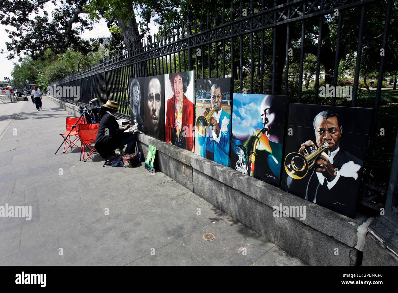 Jackson Square artist Jemu Harrington works on a portrait in the French ...