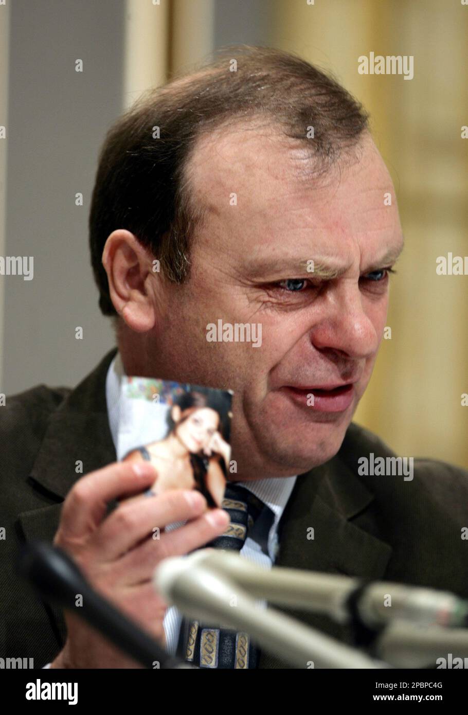 British national Bill Hawker holds a photo of his 22-year-old daughter ...