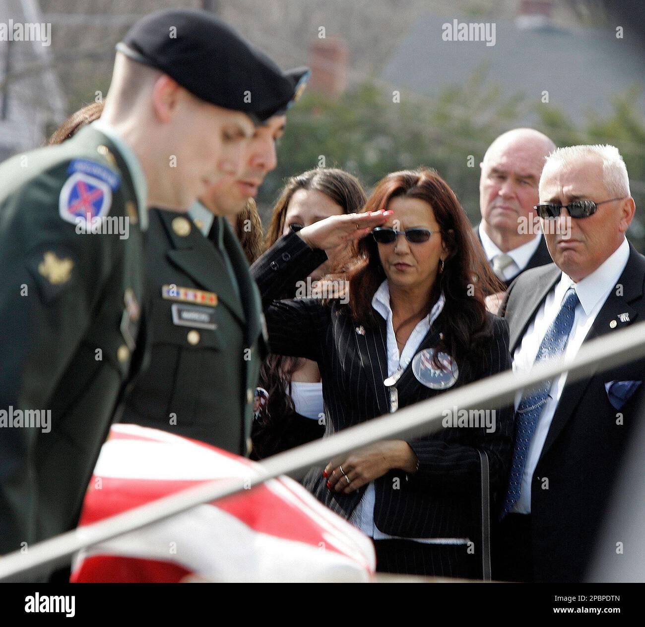 Pamela Landry, second from right,mother of U.S. Army Pfc. John Landry ...