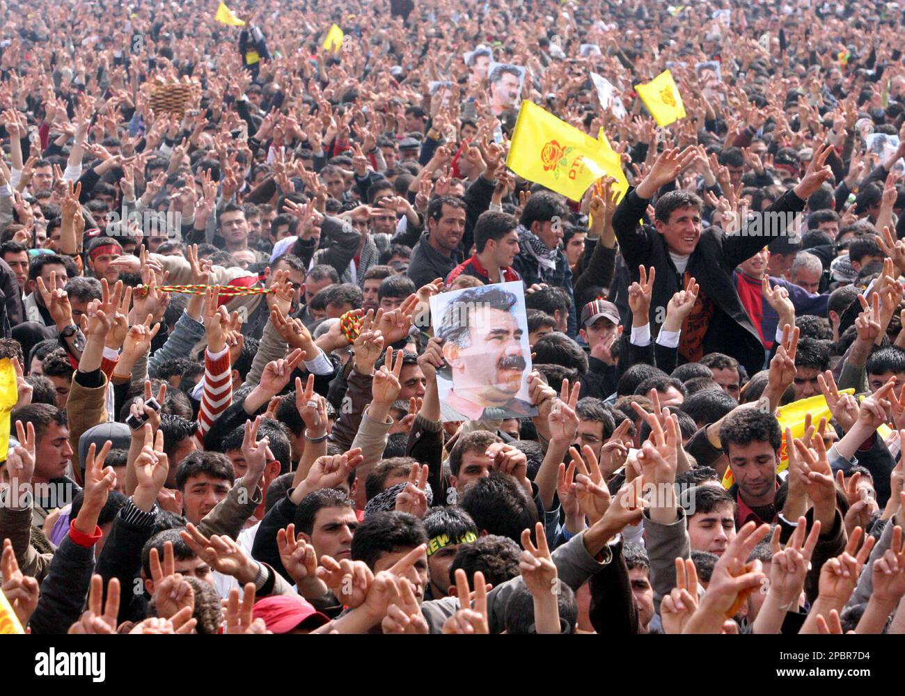 Tens of thousands of Turkish Kurds, with some of them holding flag of ...