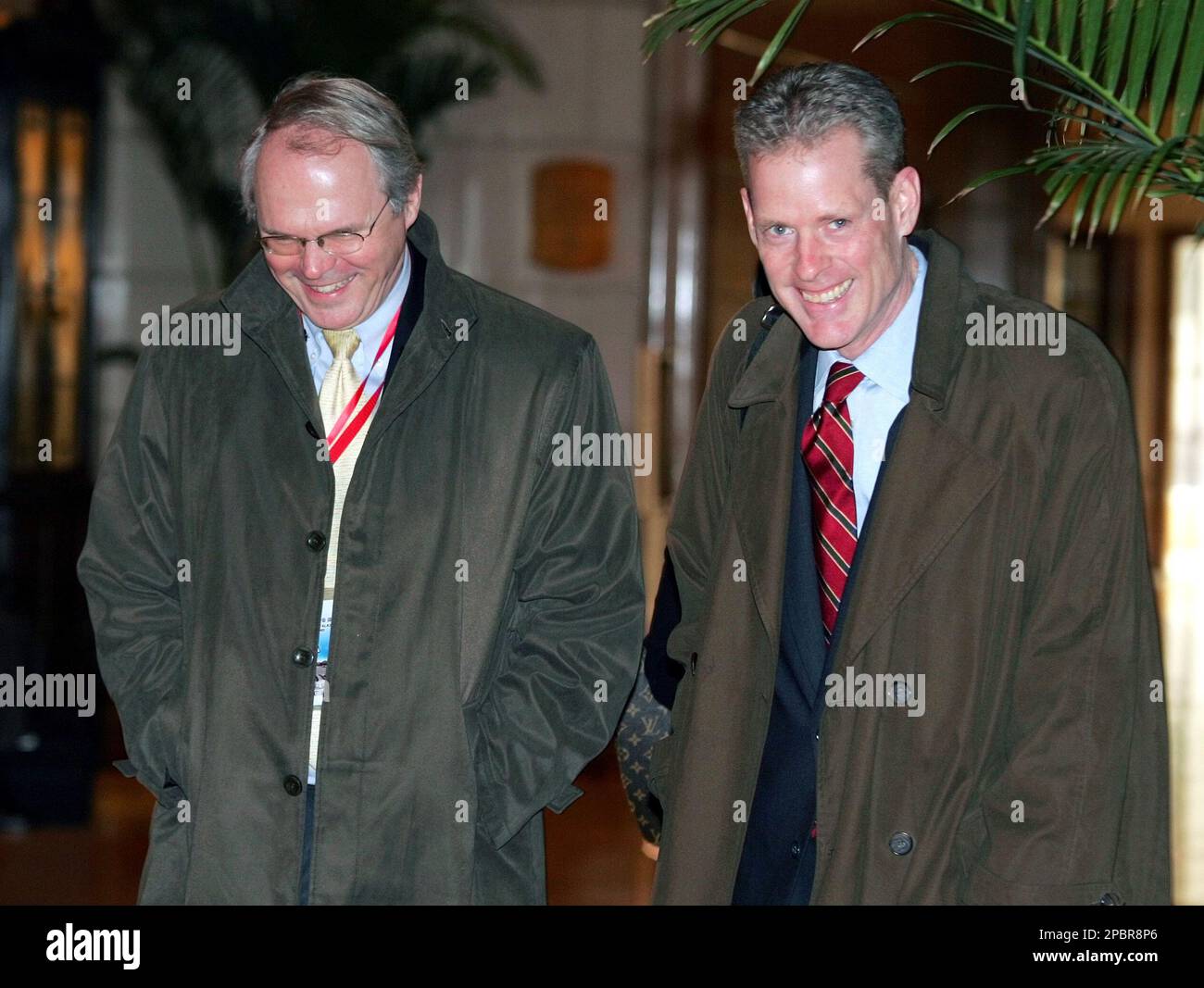 U.S. Assistant Secretary of State Christopher Hill, left, jokes with ...