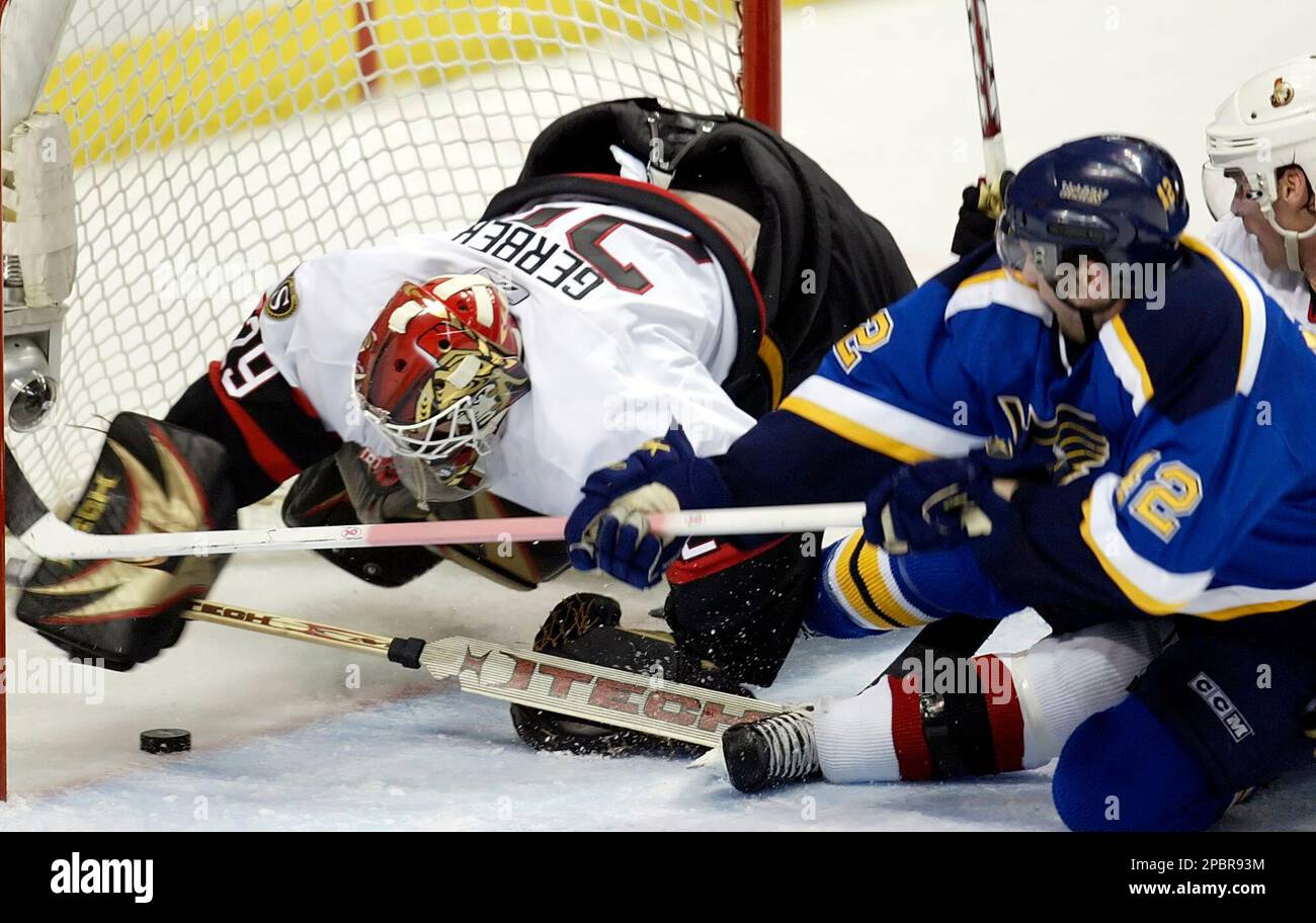 Ottawa Senators goaltender Martin Gerber, of Switzerland, dives for the ...
