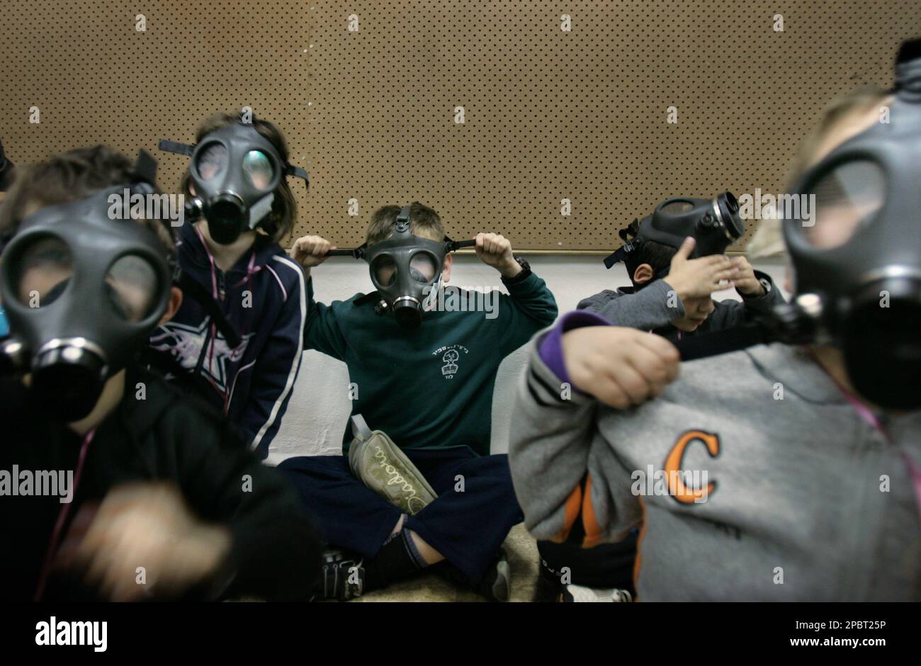 Israeli school children put on gas masks during a drill organized by ...